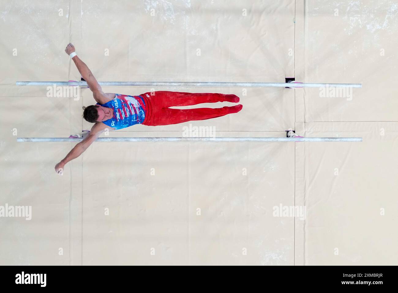 Brody Malone, of United States, performs on the parallel bars during a ...