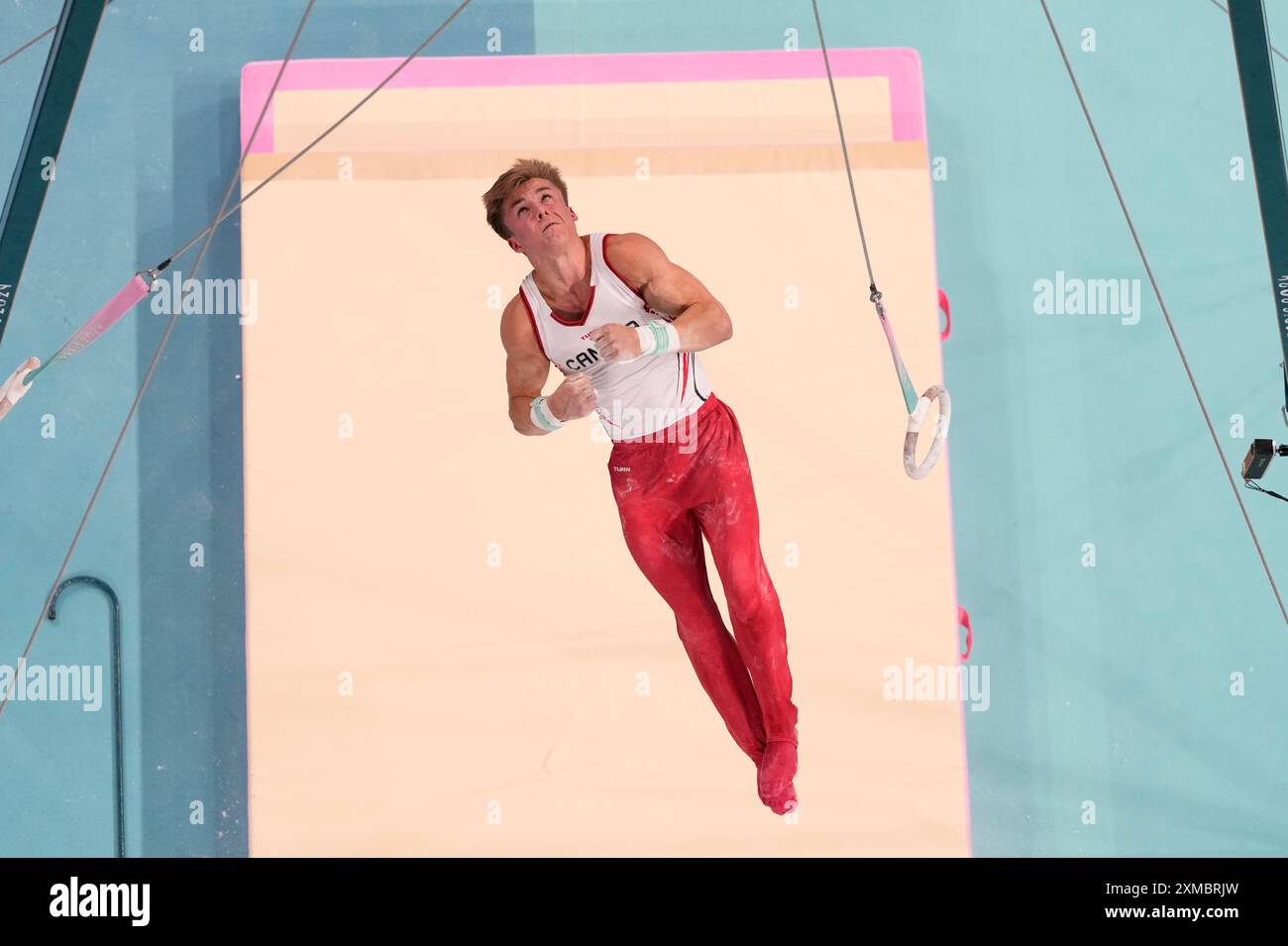 Felix Dolci, of Canada, performs on the rings during a men's artistic ...