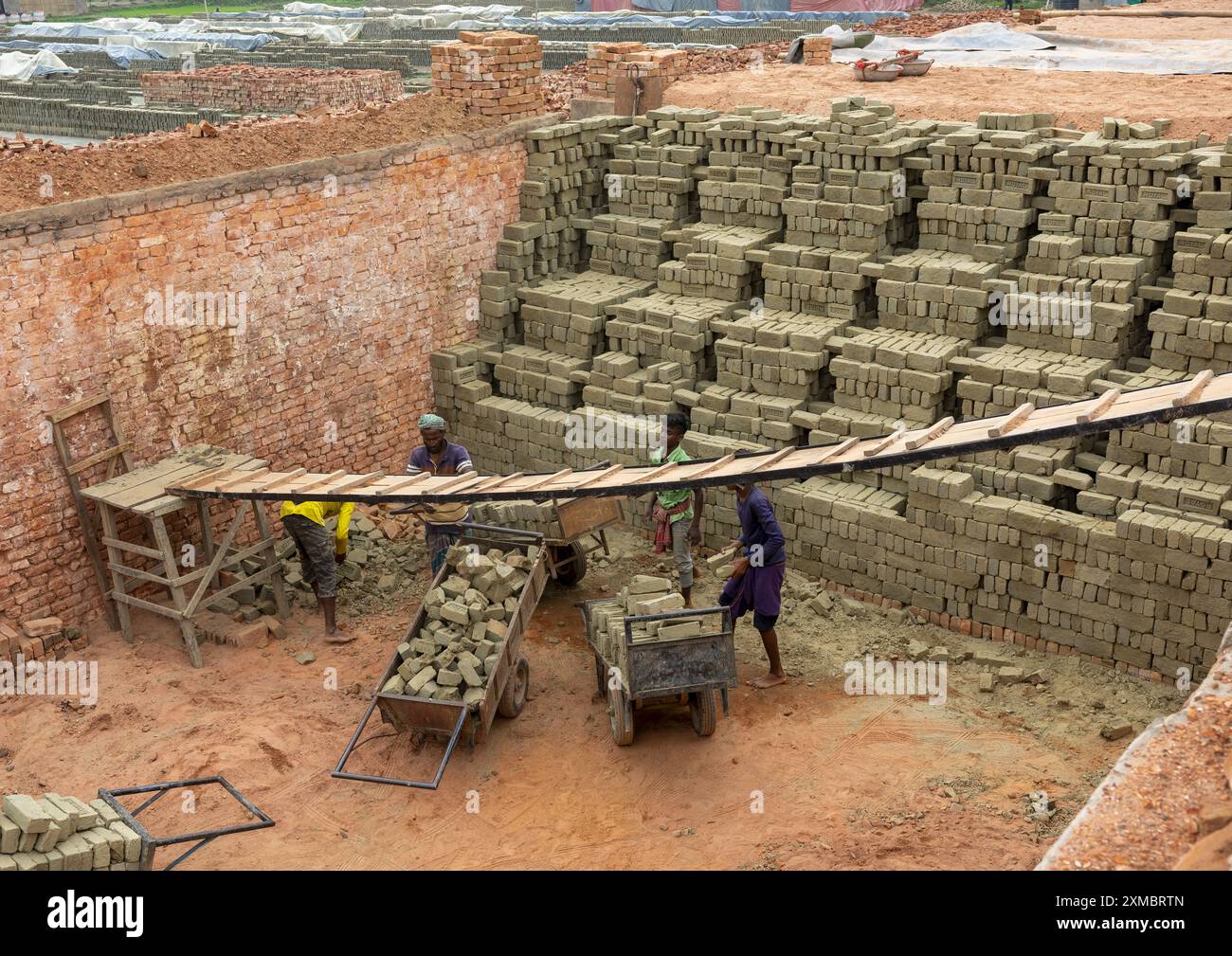 Bangladeshi brick field workers arranging bricks, Sylhet Division ...
