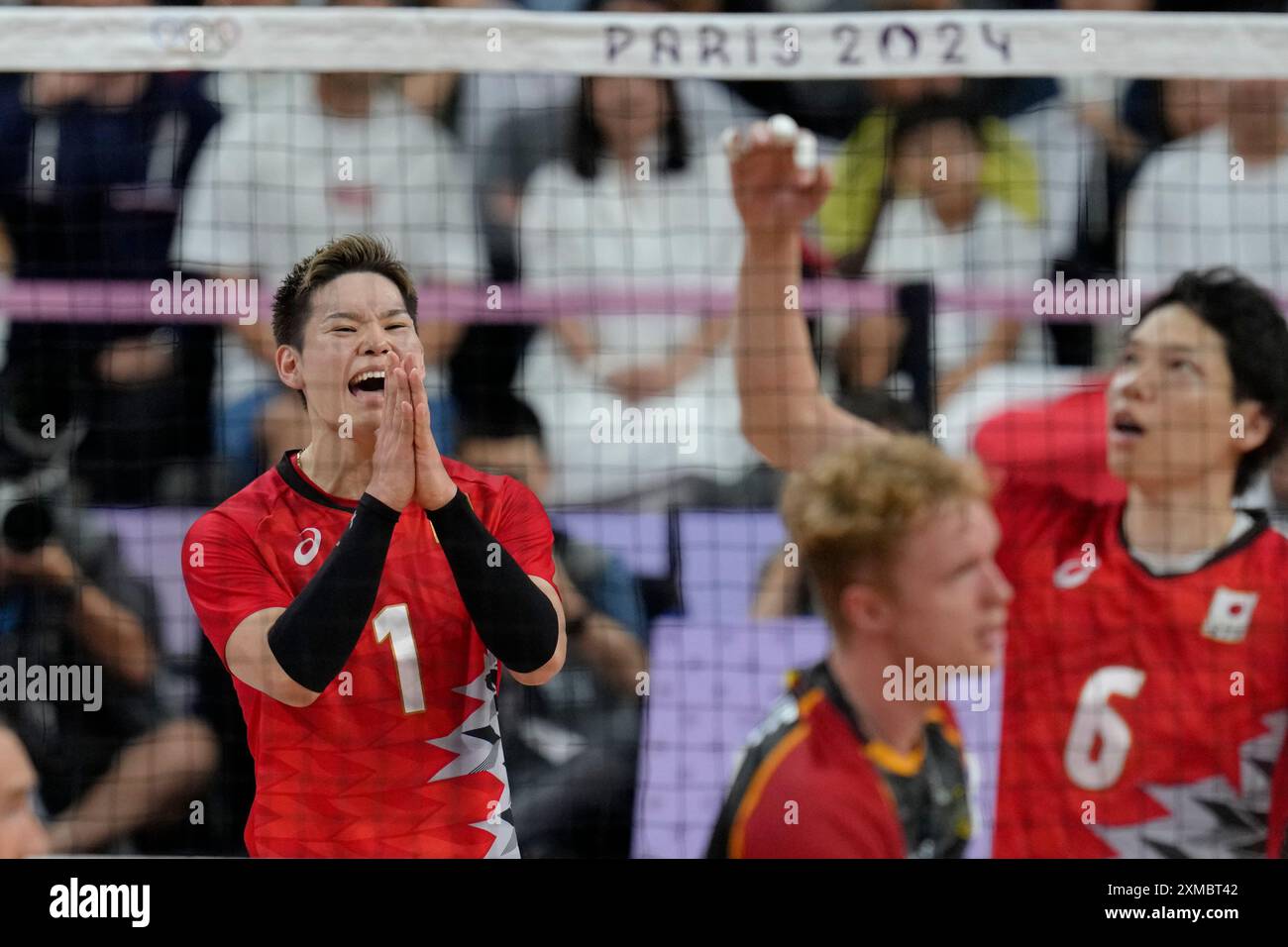 Yuji Nishida, of Japan, left, reacts, during the group C volleyball ...
