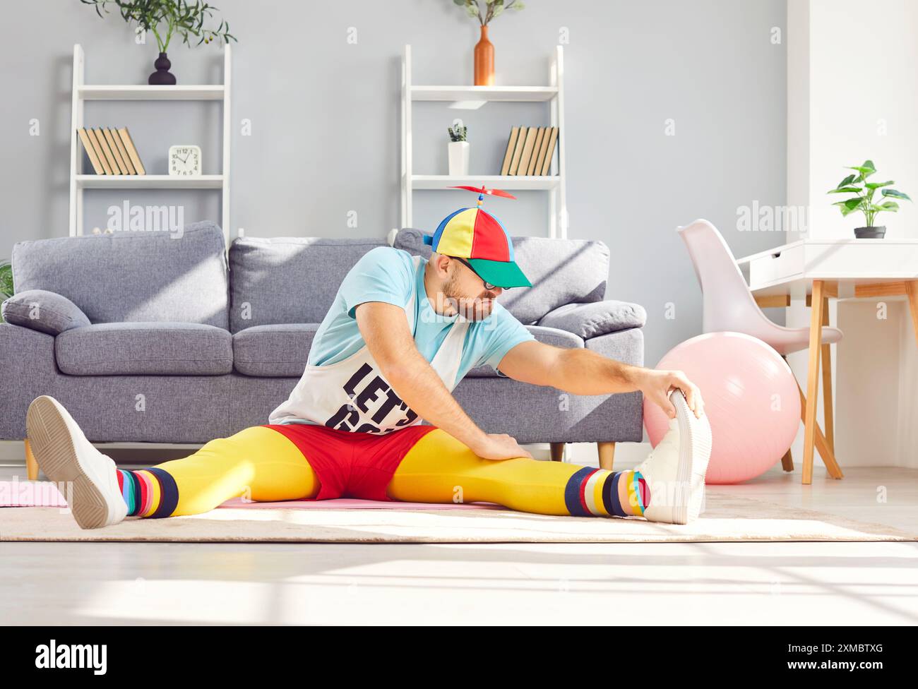 Funny happy sportsman sitting hi-res stock photography and images - Alamy