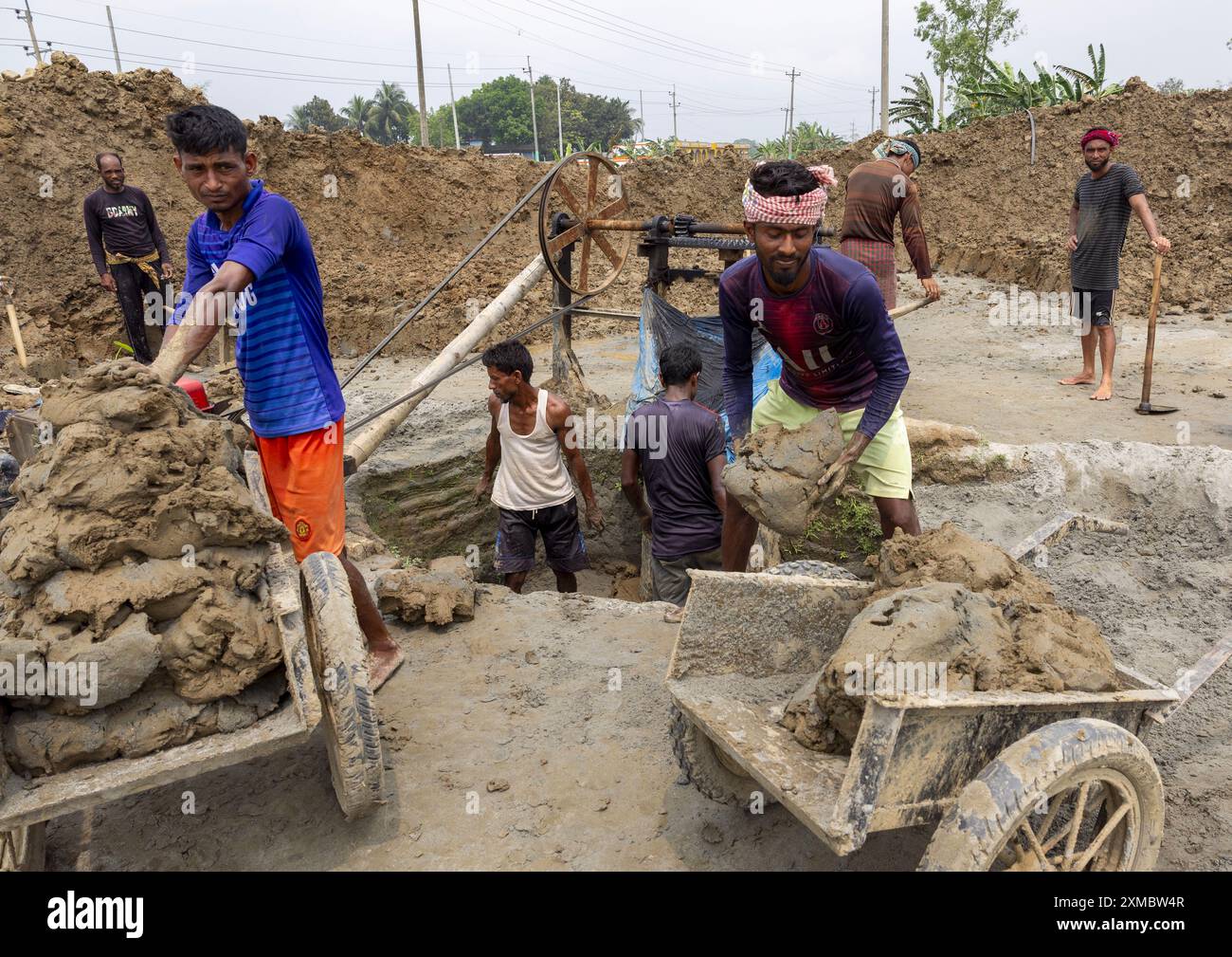 Workers digging clay in a brick factory, Sylhet Division, Bahubal ...