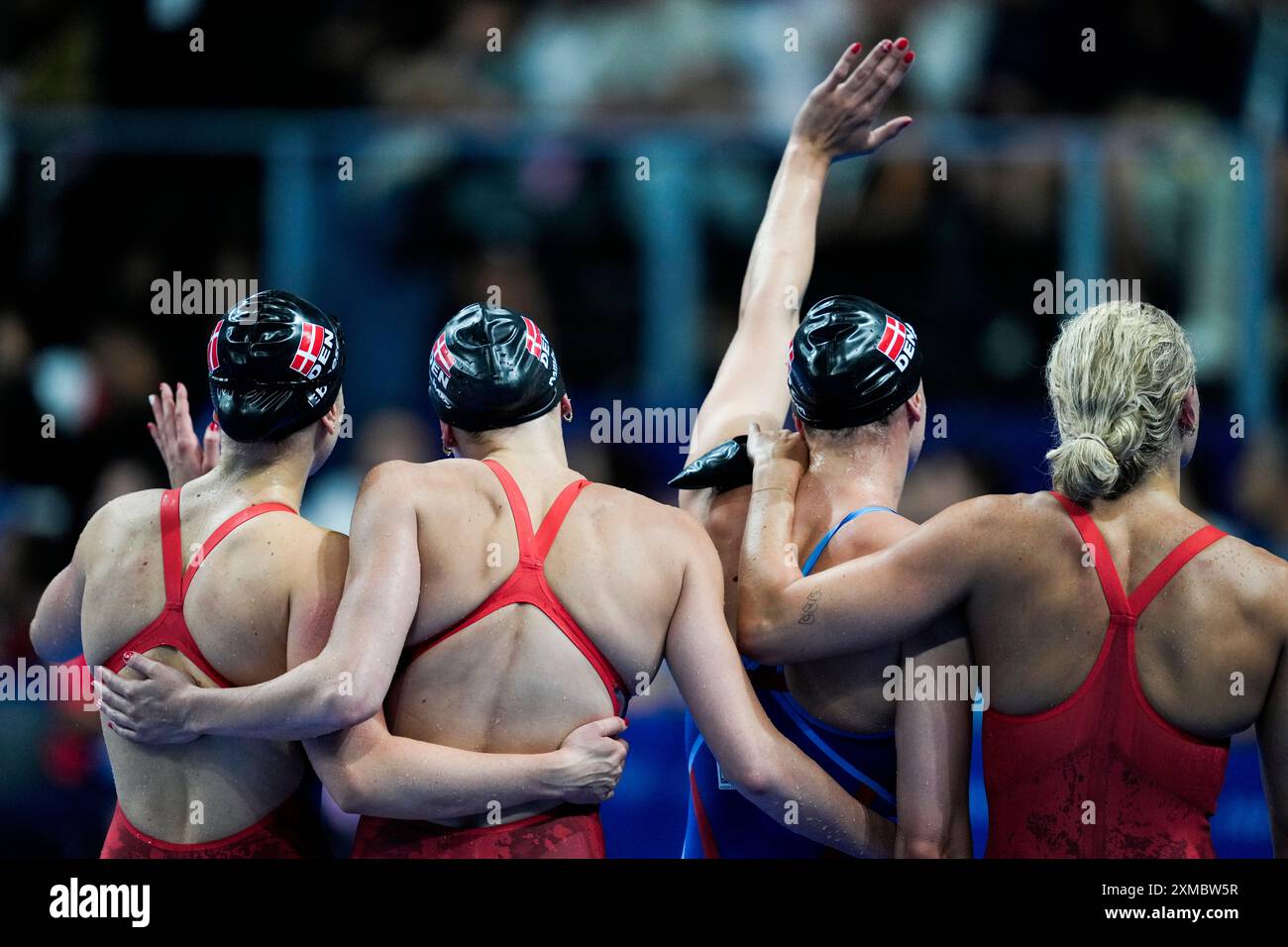The team from Denmark waves during the 4x100-meter freestyle relay at ...