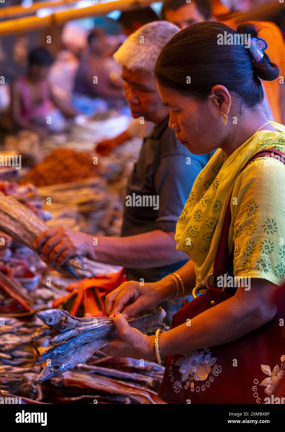 Chakma tribe people buying dried fishes at market, Chittagong Division ...
