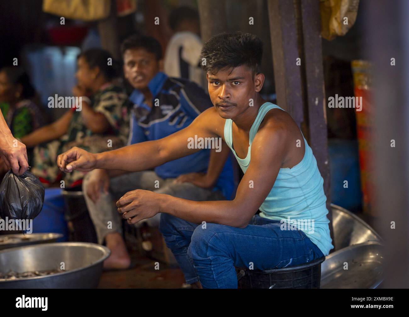 Chakma tribe man selling fish, Chittagong Division, Rangamati Sadar ...