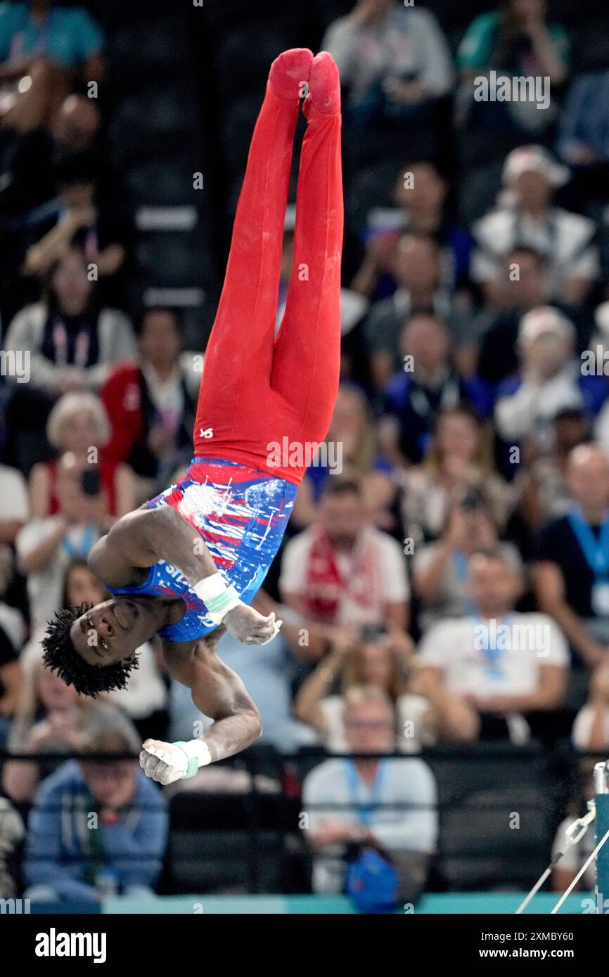 Frederick Richard, of United States, competes on the horizontal bar ...