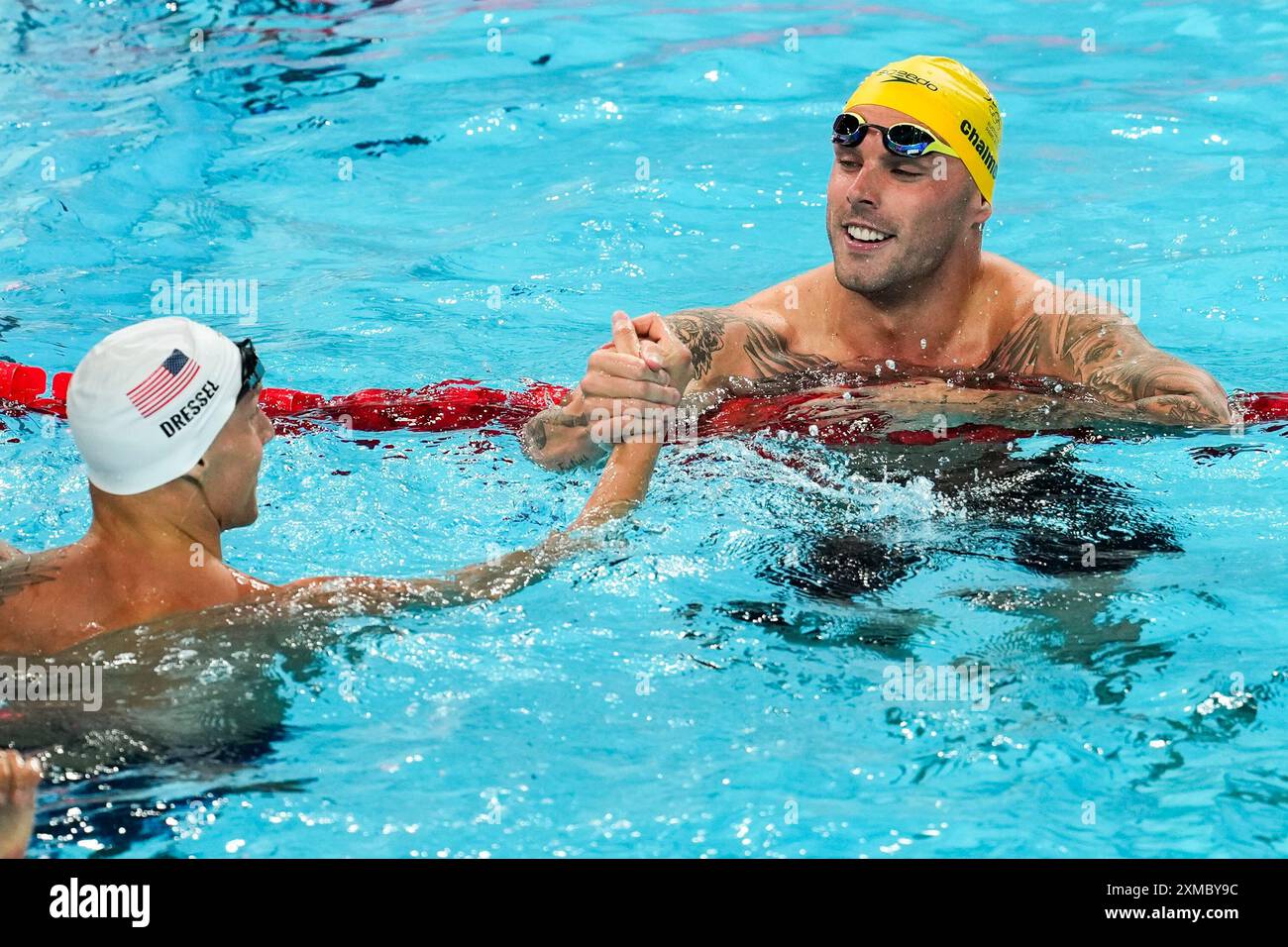 Caeleb Dressel, of the United States, left, and Kyle Chalmers, of ...