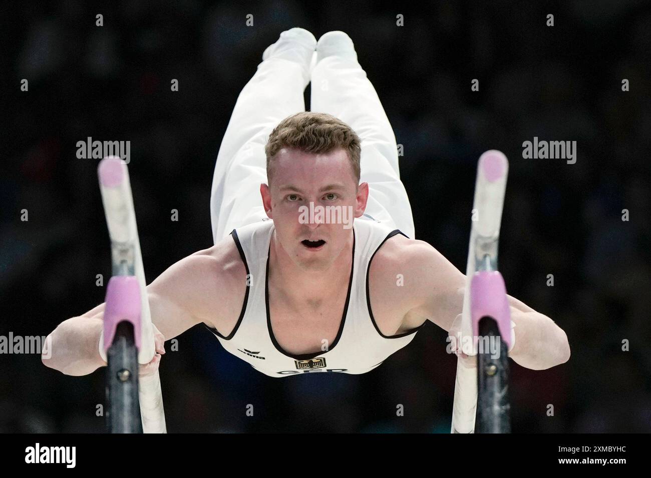 Nils Dunkel, of Germany, competes on the parallel bars during a men's ...