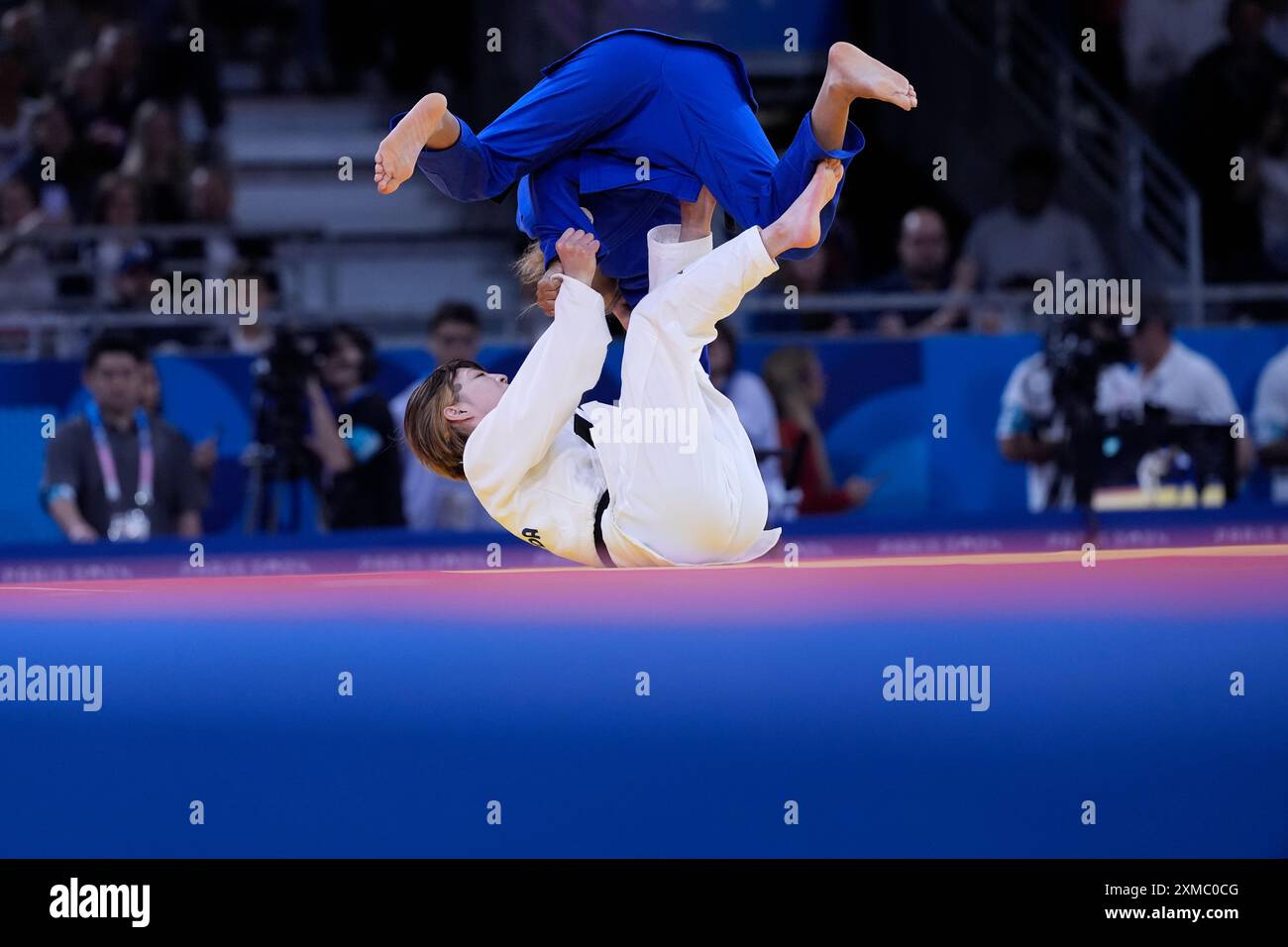 Japan's Natsumi Tsunoda, bottom, and France's Shirine Boukli compete ...