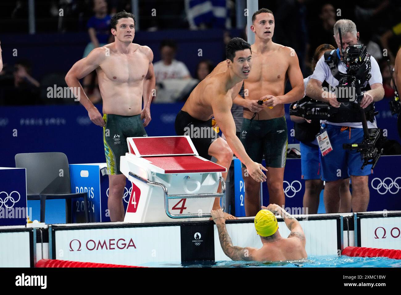 Australian men's 4x100m freestyle relay team react following their heat ...