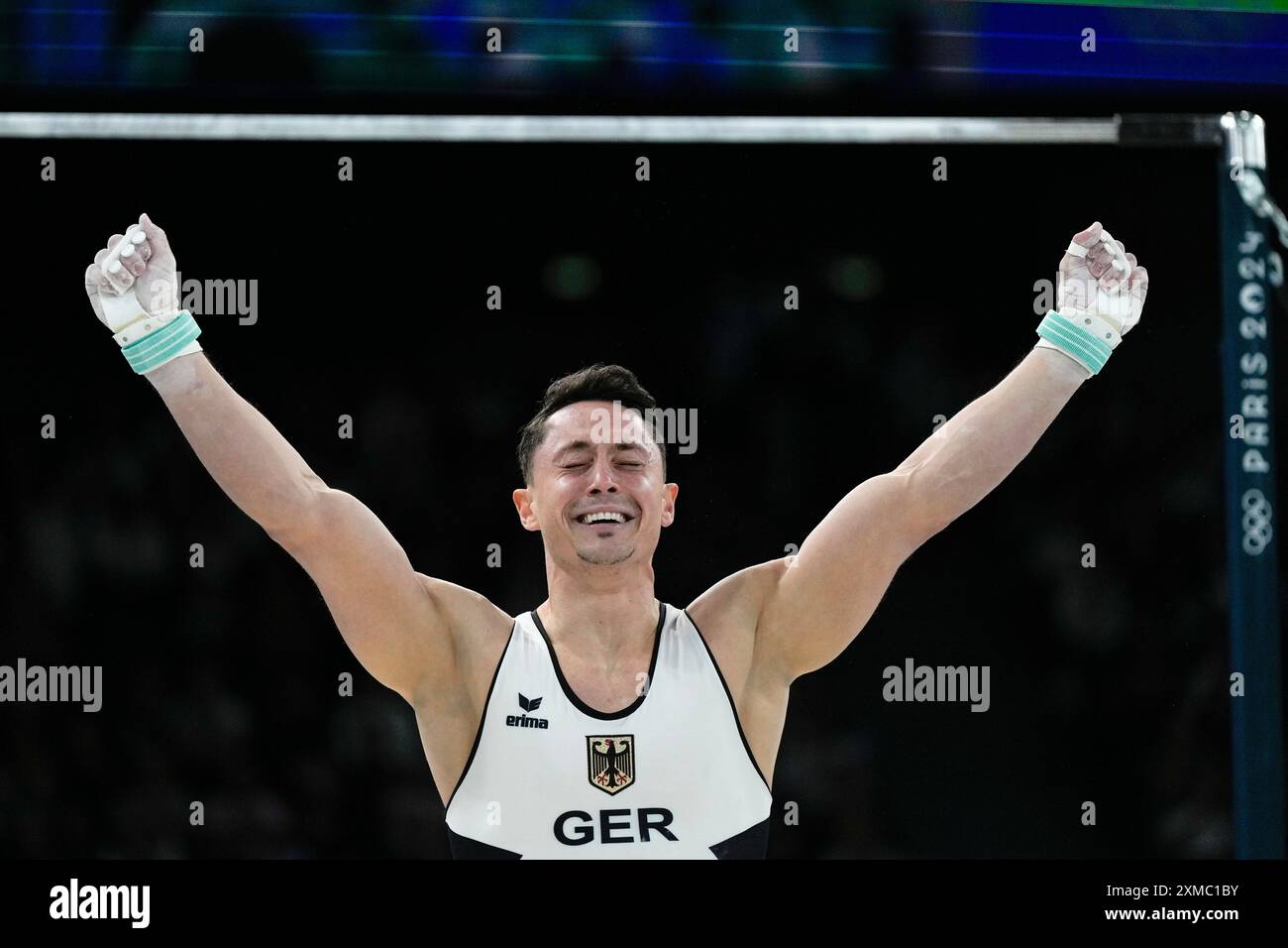 Andreas Toba, of Germany, celebrates after competing on the horizontal ...