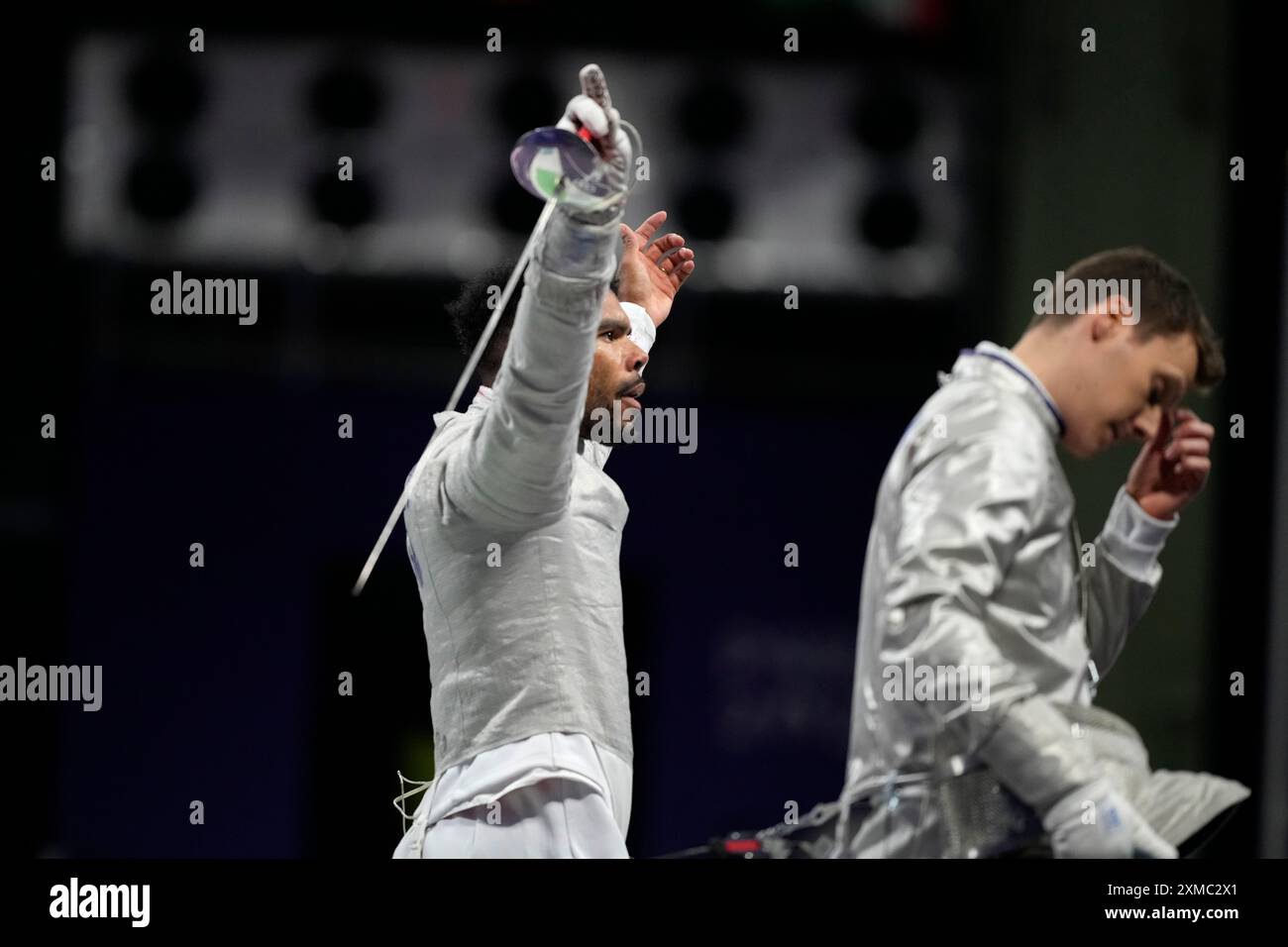 France's Bolade Apithy, left, celebrates in the men's individual Sabre ...