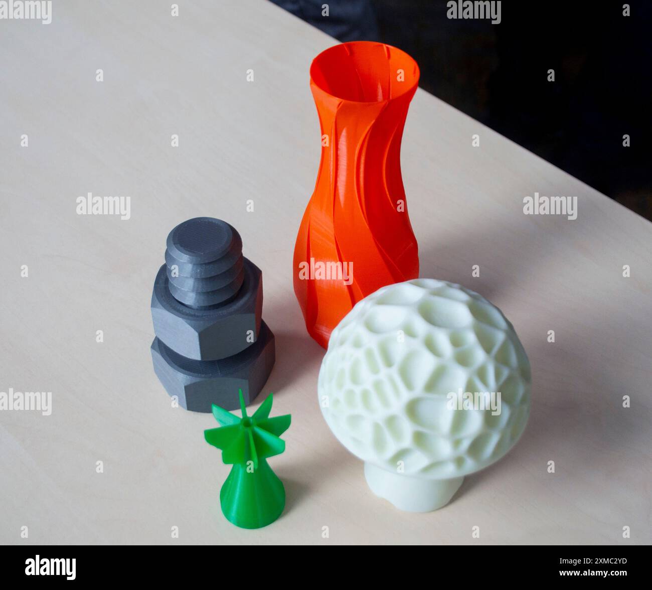 Several art multi-colored objects printed on a 3D printer. Model red ...