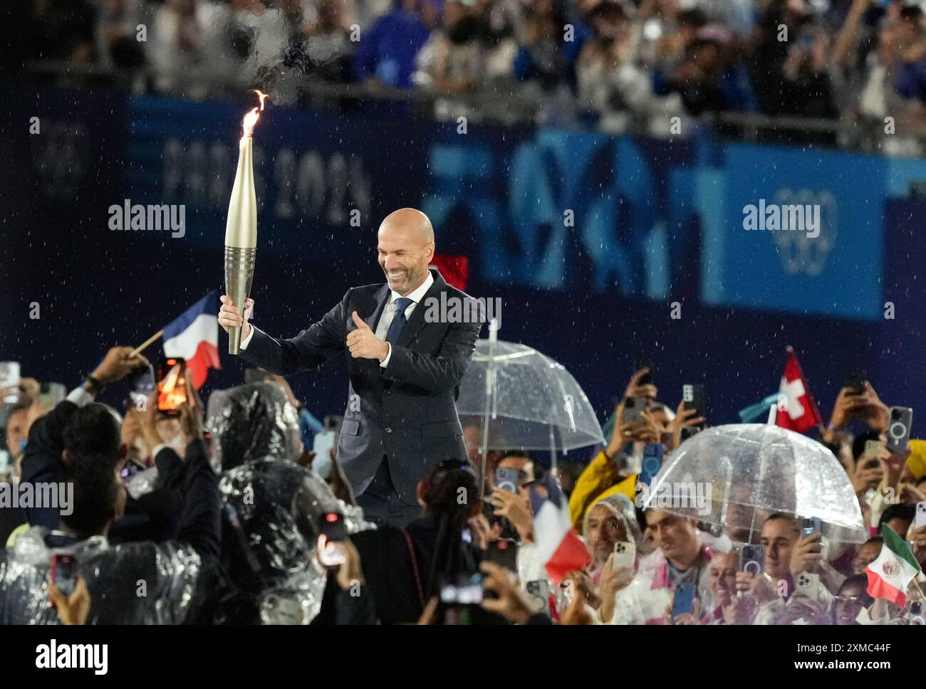 Paris, France. 26th July, 2024. French soccer star Zinedine Zidane ...
