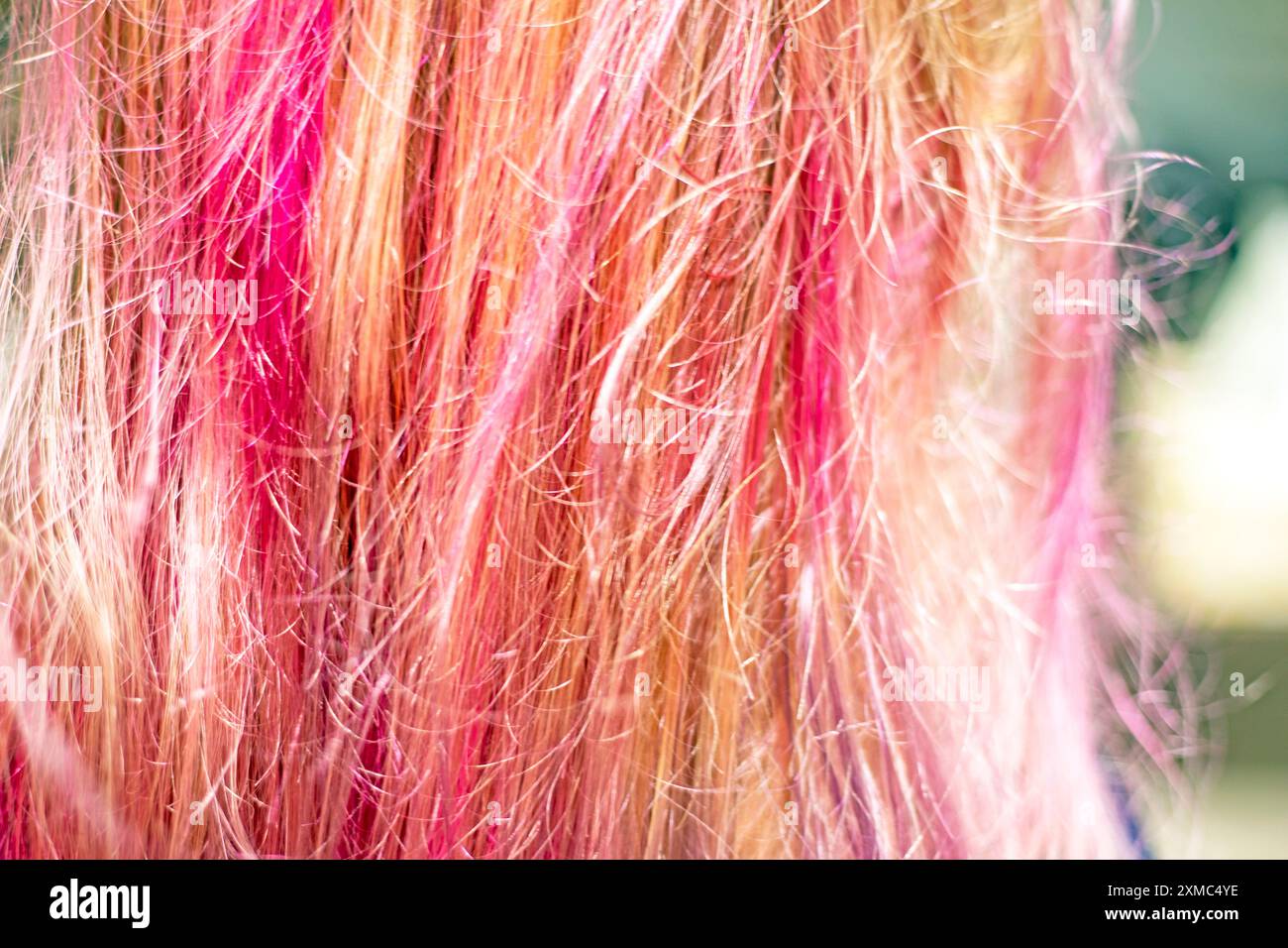 background of bright pink and purple strands of hair. Modern hairstyles ...