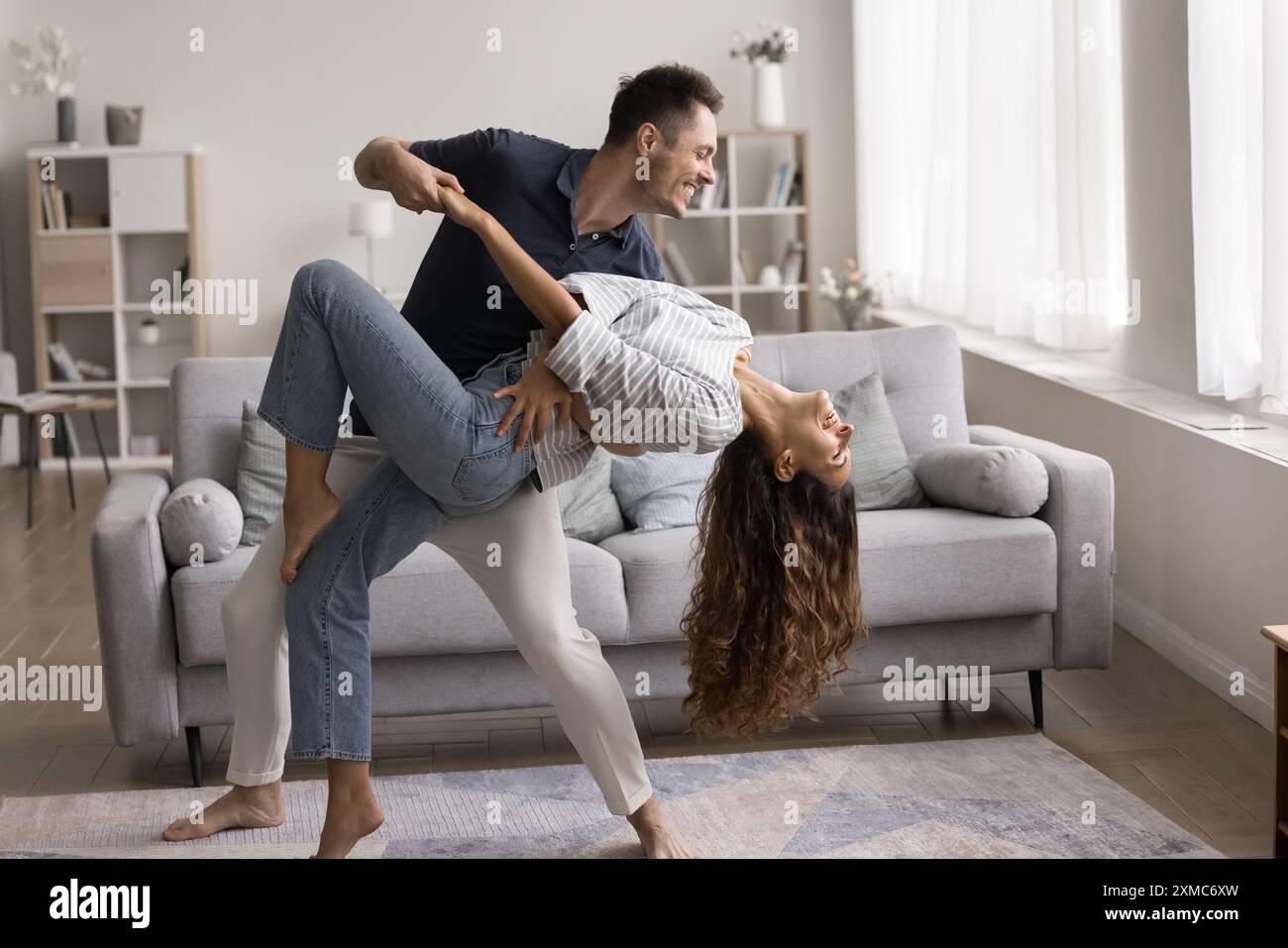 Happy couple in love dancing rehearsing wedding dance at home Stock ...