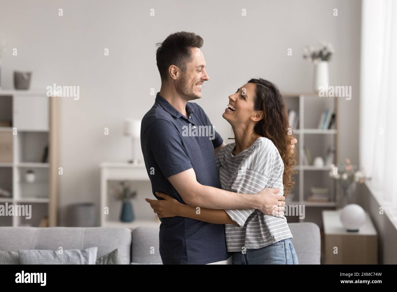 Loving couple gently hugging hi-res stock photography and images - Alamy