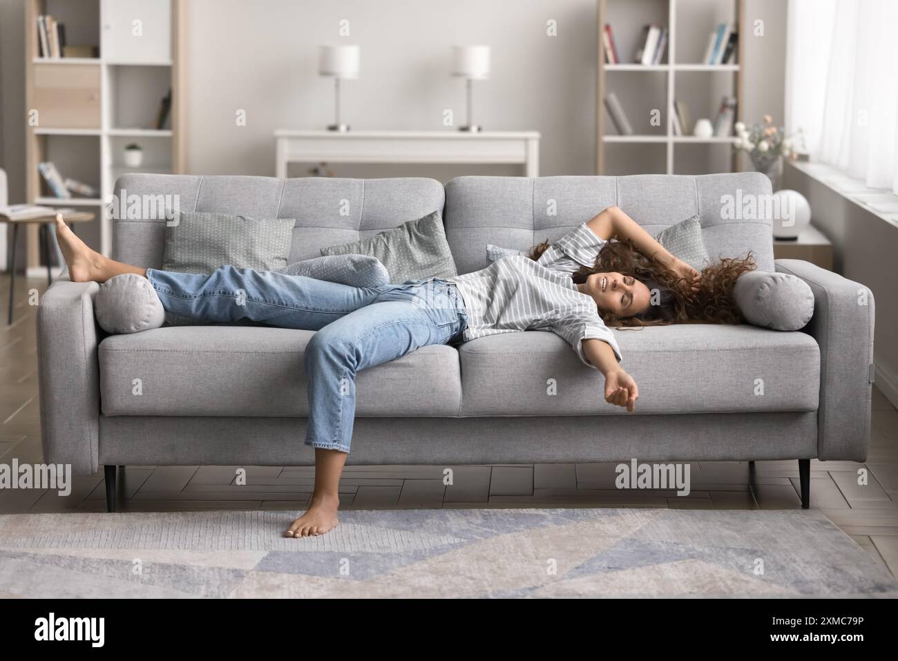 Sprawled out on sofa hi-res stock photography and images - Alamy