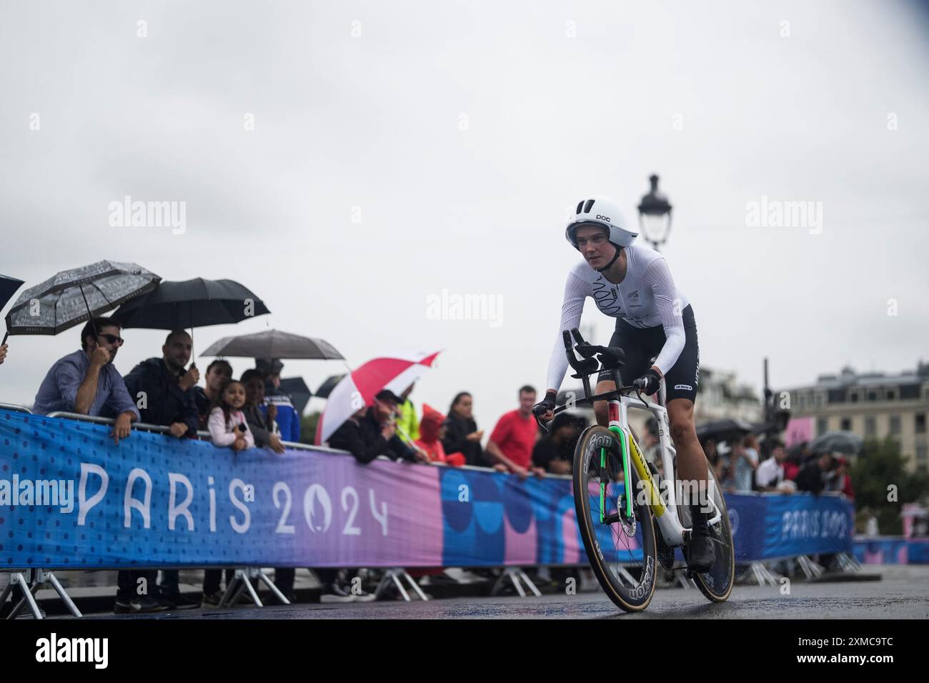 Kim Cadzow, of New Zealand, competes in the women's cycling time trial ...