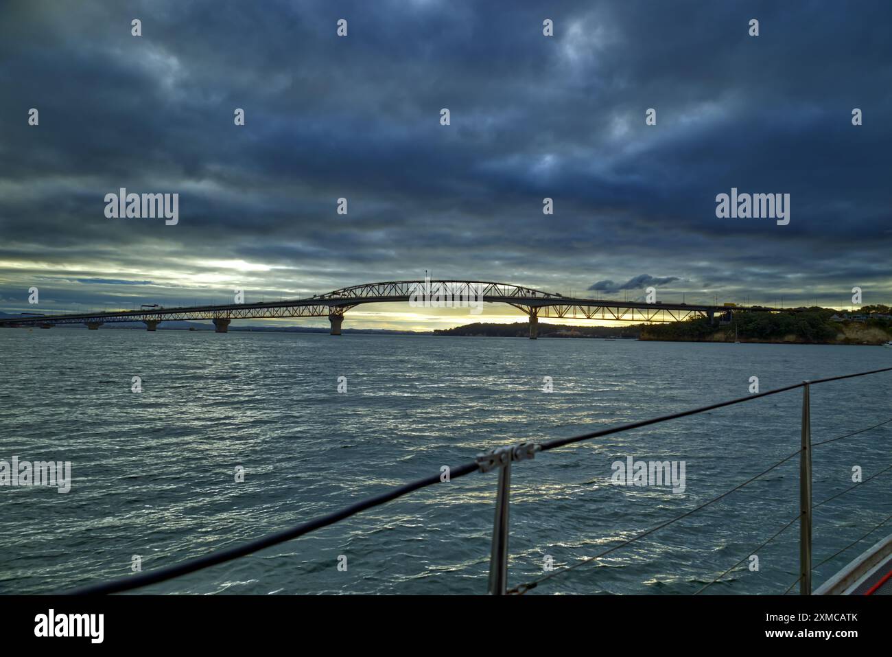 Auckland Harbour, New Zealand - Auckland Harbour Bridge at sunset ...
