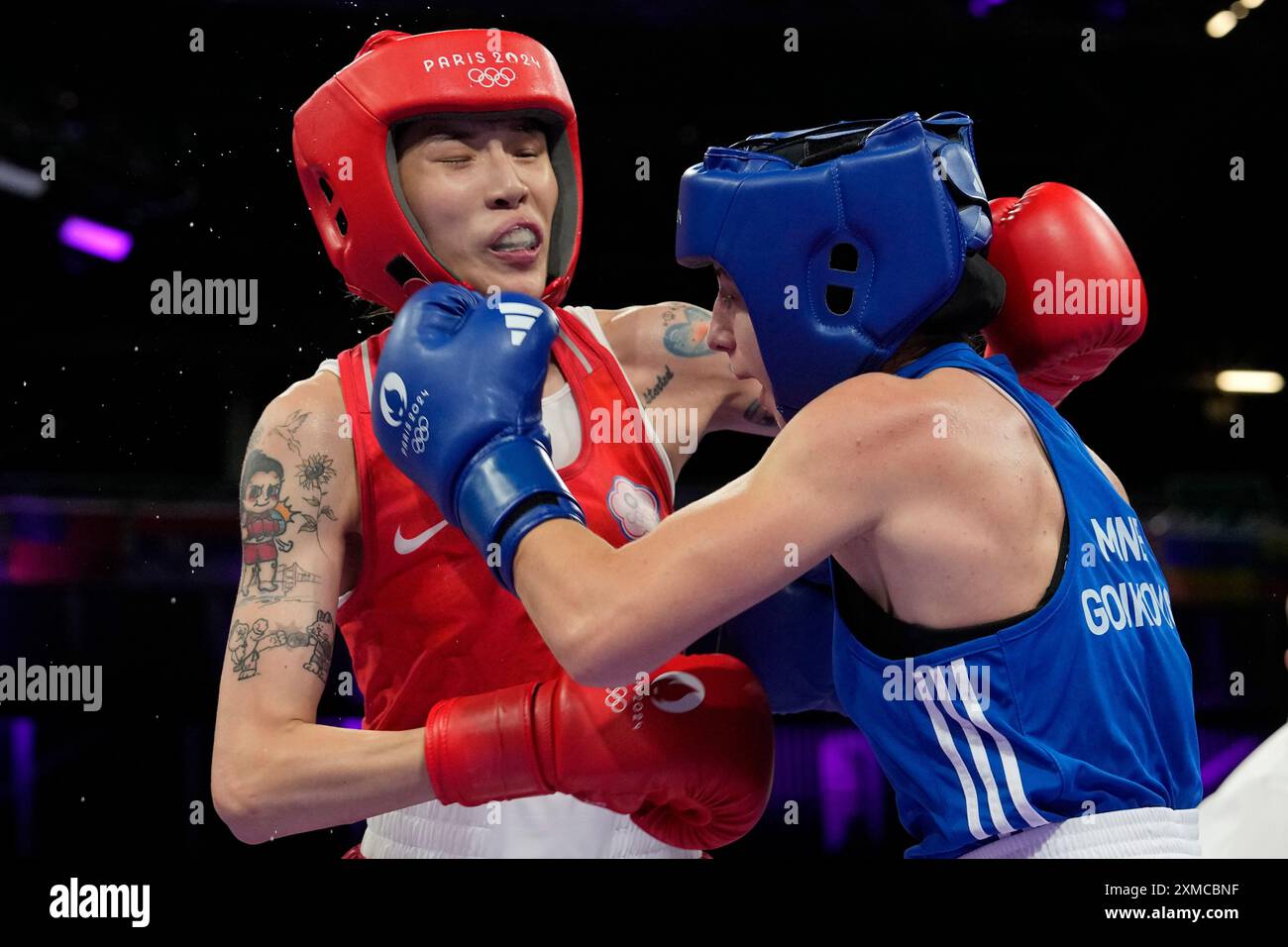 Montenegro's Bojana Gojkovic, right, hits, Taiwan's Huang Hsiao-Wen in ...