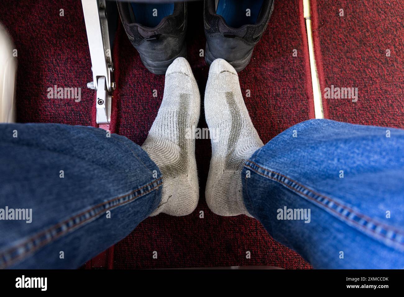 Airplane passenger removed shoes in cabin to relax feet during long ...