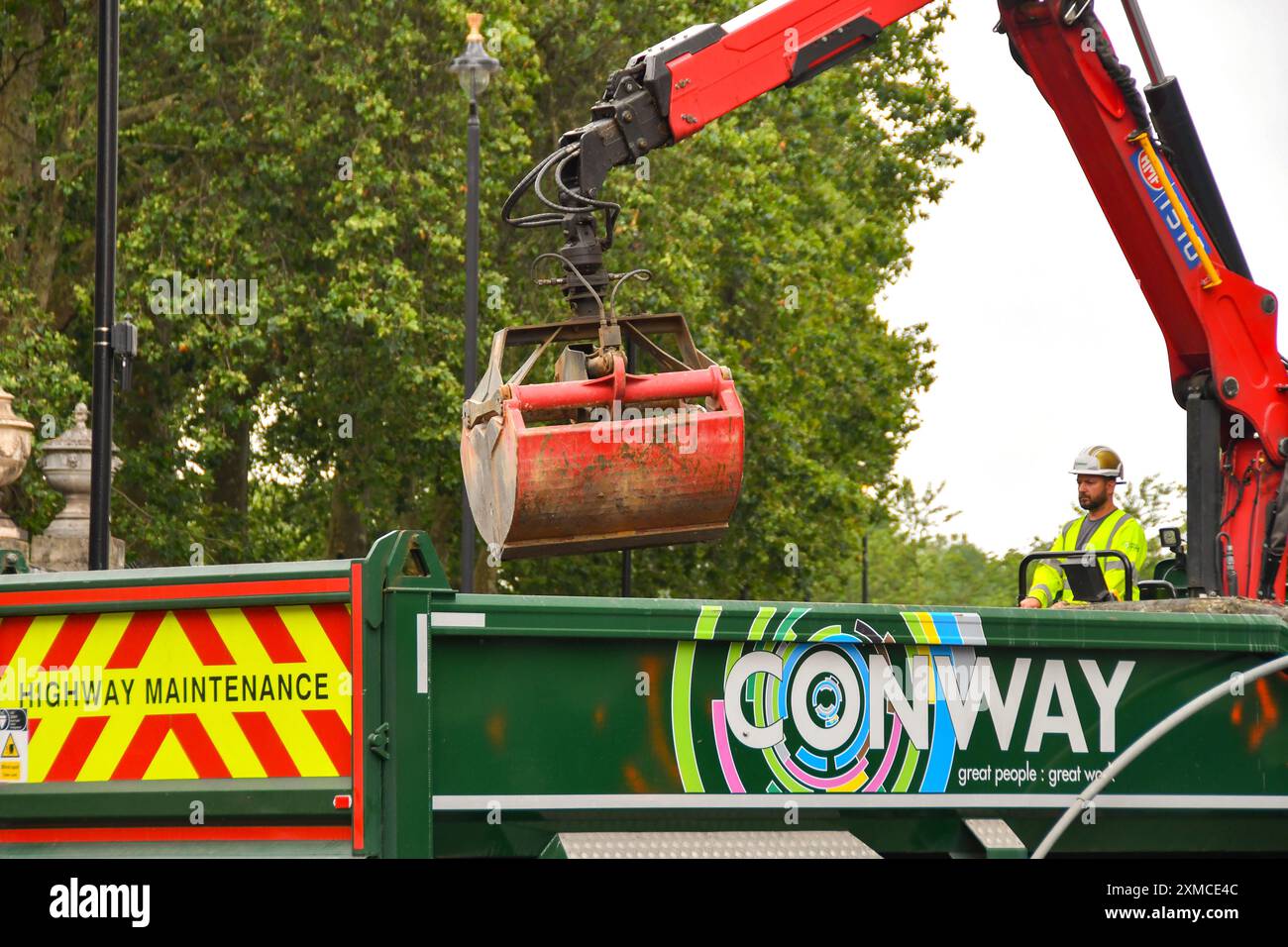 London, England, UK - 27 June 2023: Construction worker operating a ...