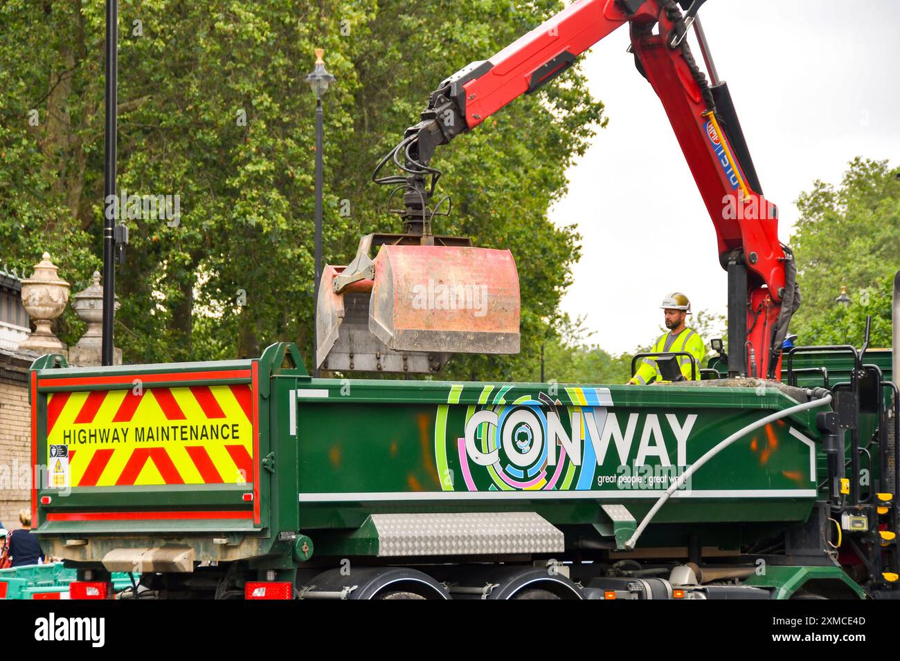London, England, UK - 27 June 2023: Construction worker operating a ...