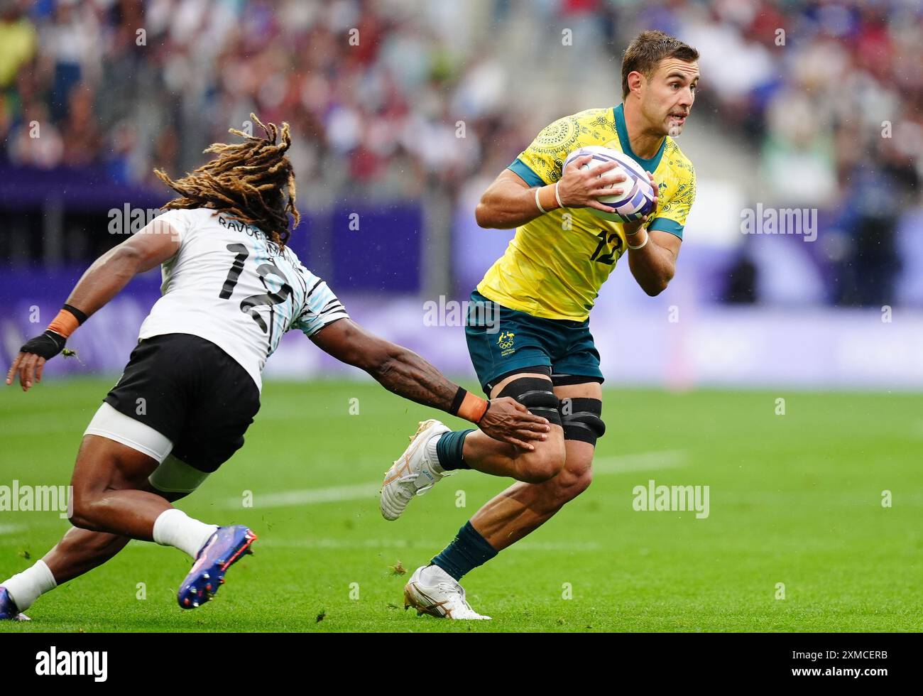 Australia's Nathan Lawson (right) goes past Fiji's Selestino ...