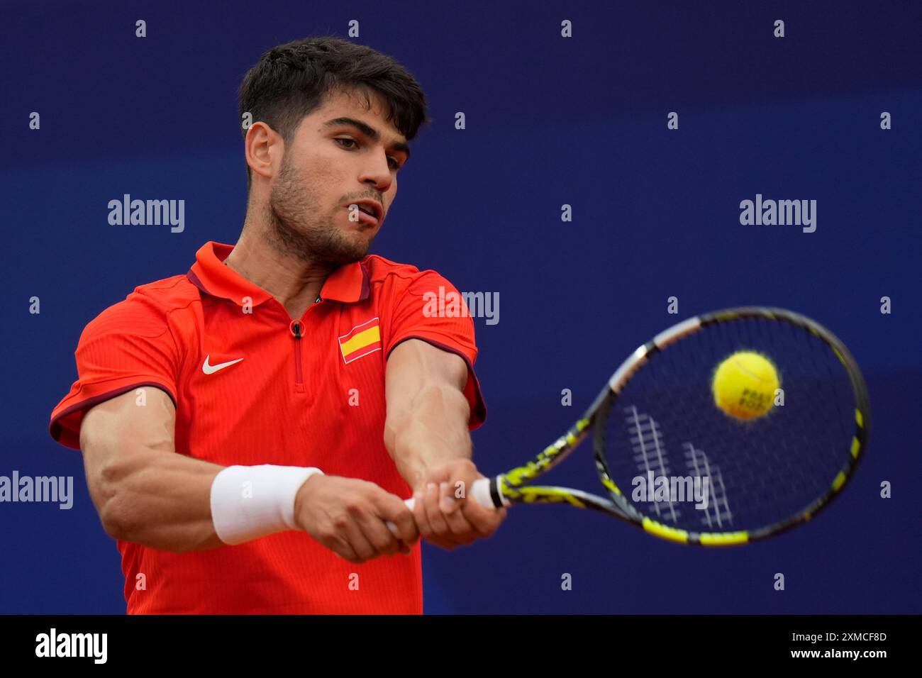 Carlos Alcaraz of Spain returns a backhand shot to Hady Habib of ...