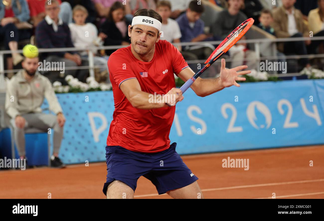 Paris, France. 27th July, 2024. USA'S Taylor Fritz plays a volley in ...