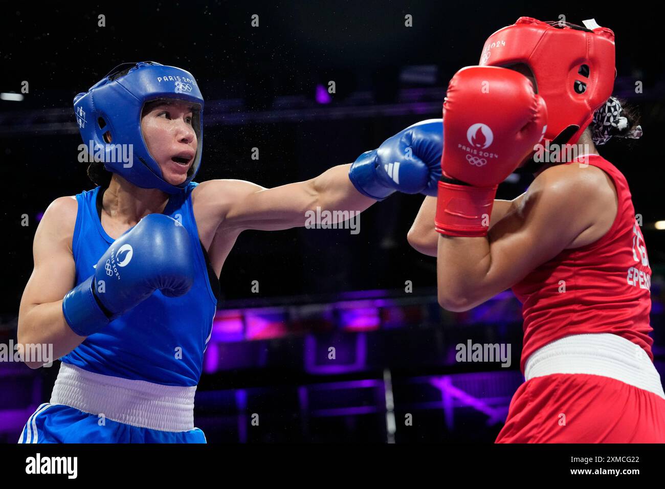 Tonga's Feofaaki Epenisa, right, fights Vietnam's Ha Thi Linh in their ...