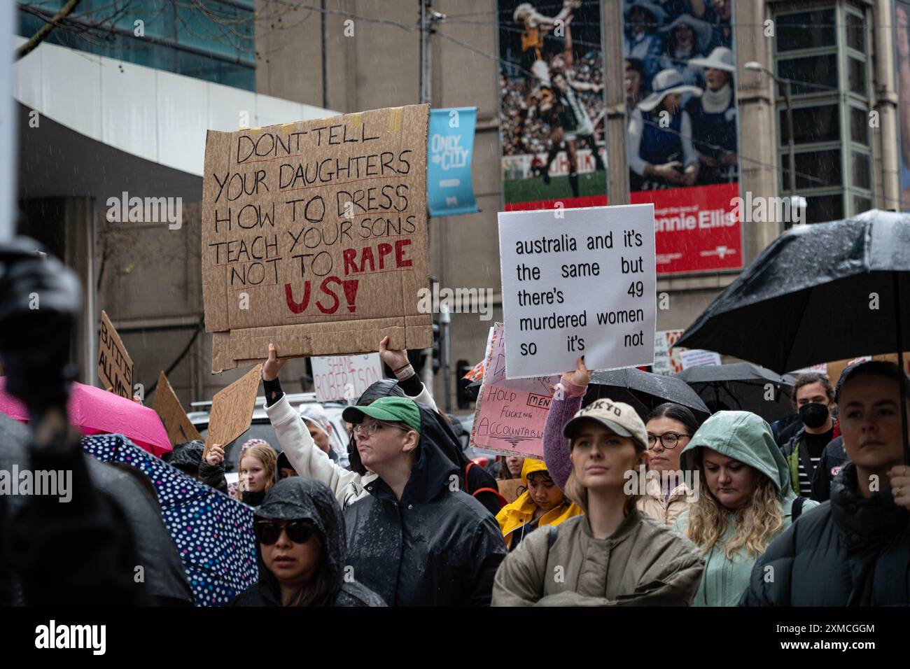 Melbourne, Australia. 27th July, 2024. Protesters hold placards ...