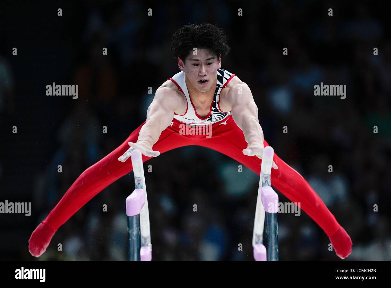 Daiki Hashimoto, of Japan, competes on the parallel bars during a men's ...