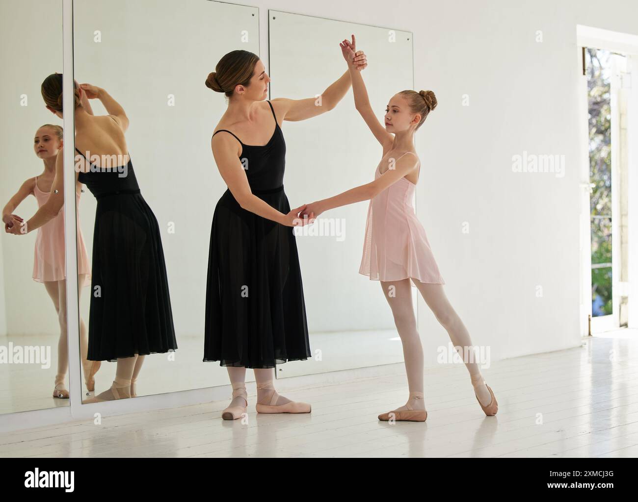 Ballet, mentor and girl in studio for learning, arms and correct ...