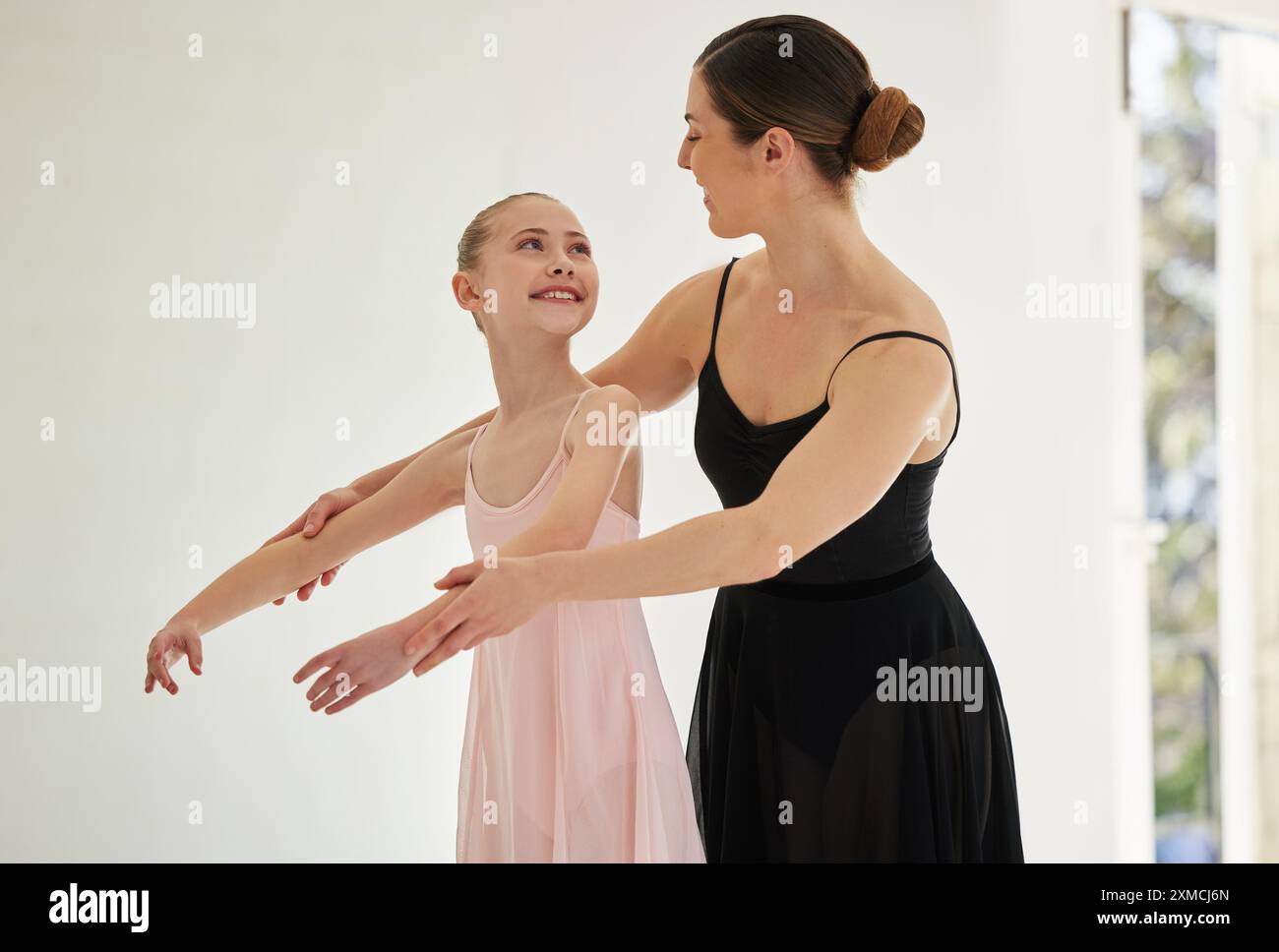 Ballet, mentor and girl happy for learning, arms and correct posture or ...