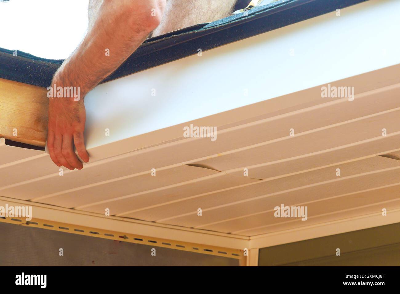 An aluminum composite panel fascia trim is installed at perimeter of ...