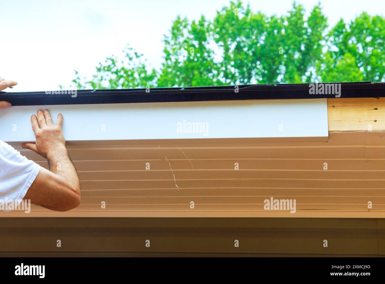 Installation of aluminum composite panels fascia trim at exterior ...