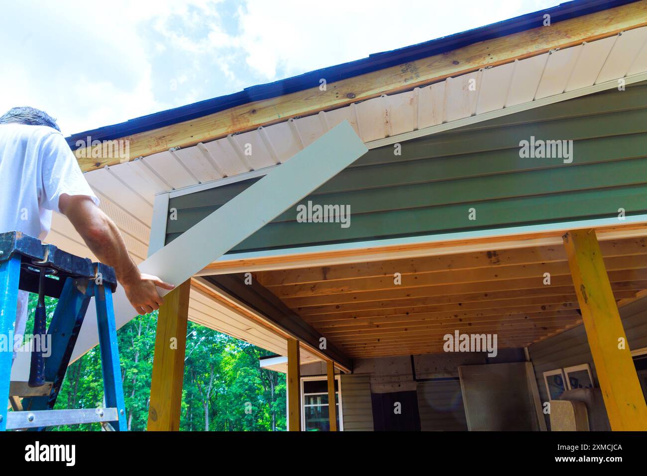 Installation of aluminum composite panels fascia trim at exterior ...