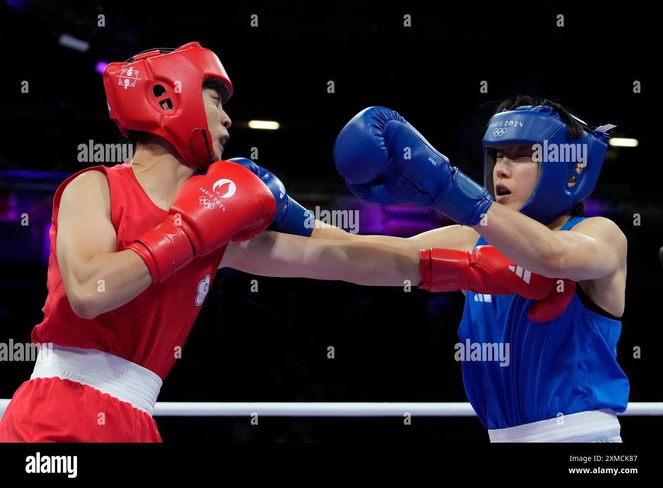 Taiwan's Wu Shih-Yi, left, hits South Korea's Oh Yeonji in their women ...