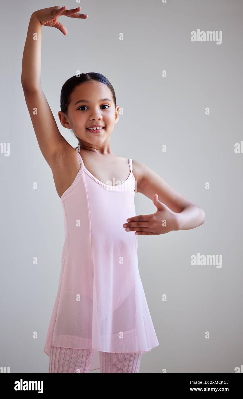 Girl, child and ballet portrait in studio, dance training and ballerina ...