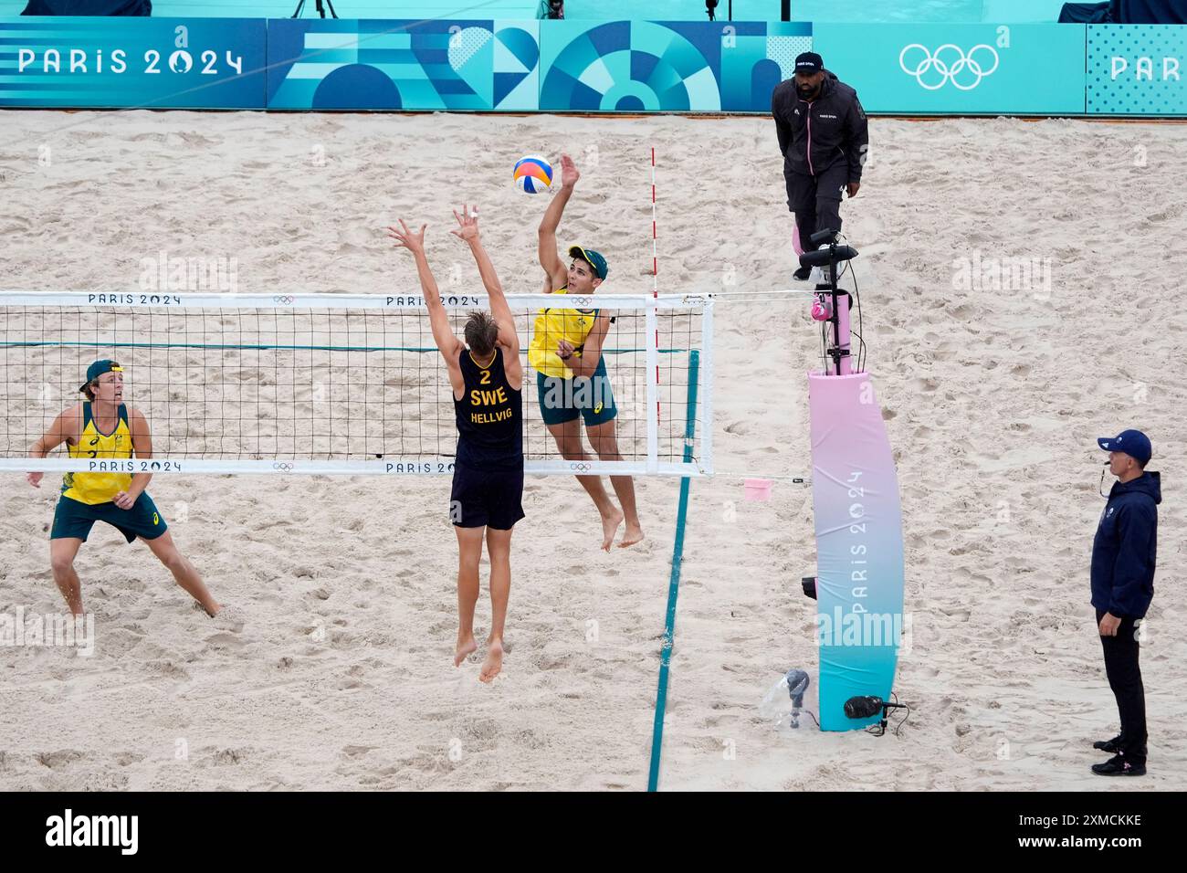 Australia's Mark Nicolaidis hits against Sweden's Jonatan Hellvig as ...