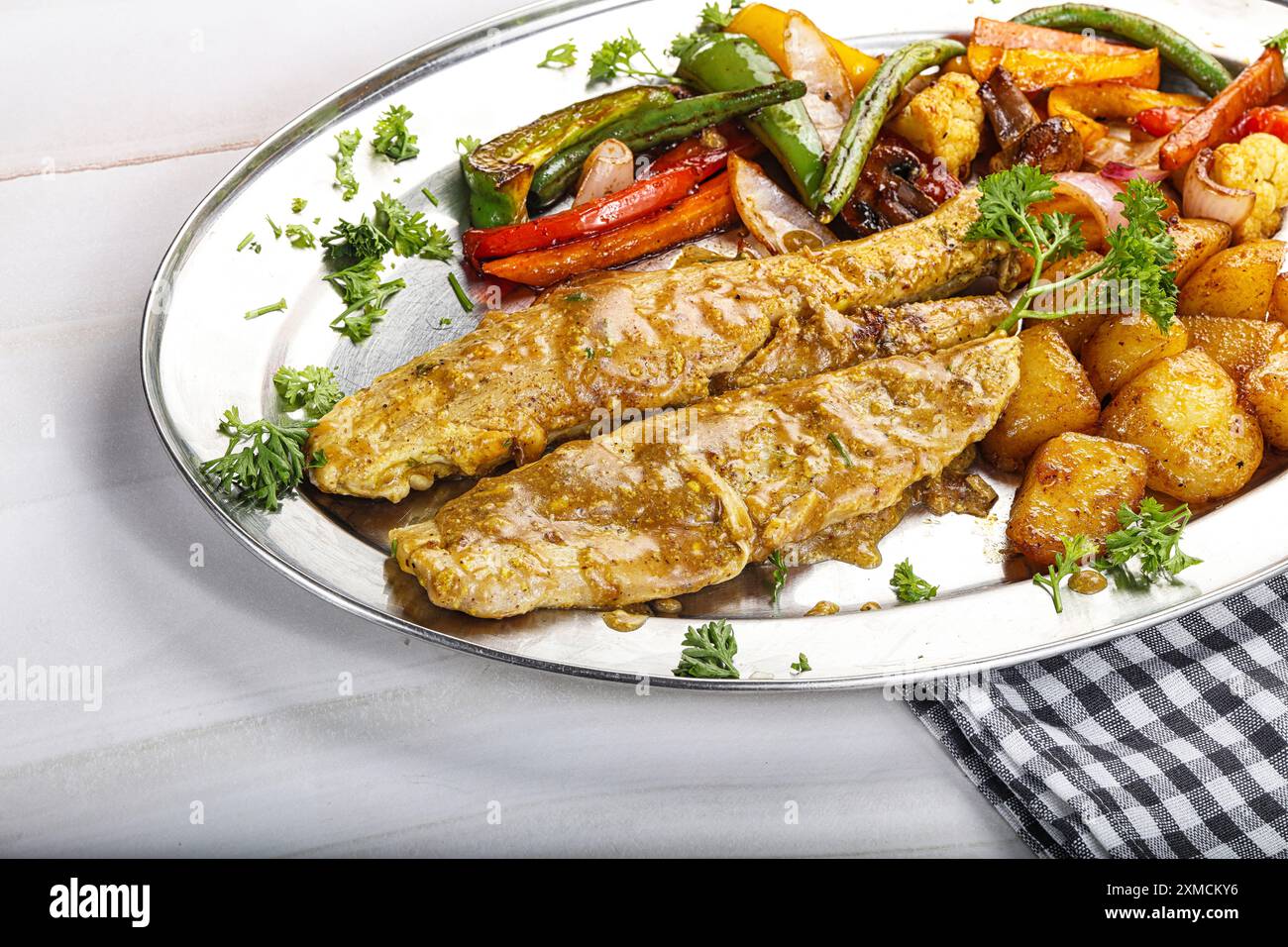 Roasted shark steak with potato and vegetable garnish Stock Photo - Alamy