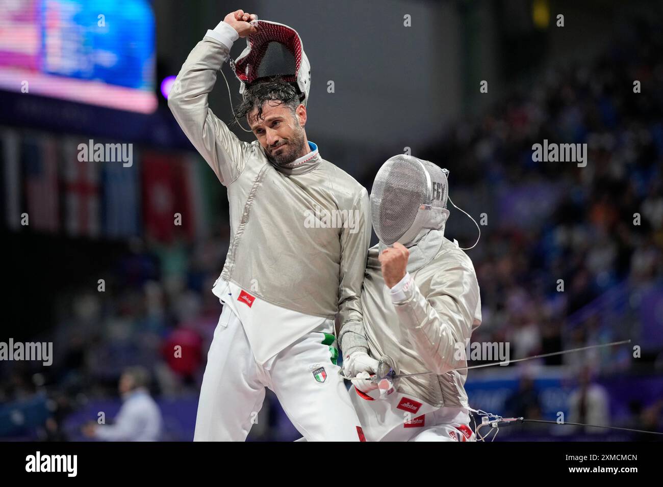 Italy's Luigi Samele, left, and Egypt's Mohamed Amer compete in the men ...