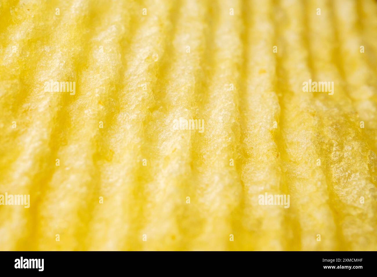 Potato chip pattern texture background closeup Stock Photo - Alamy