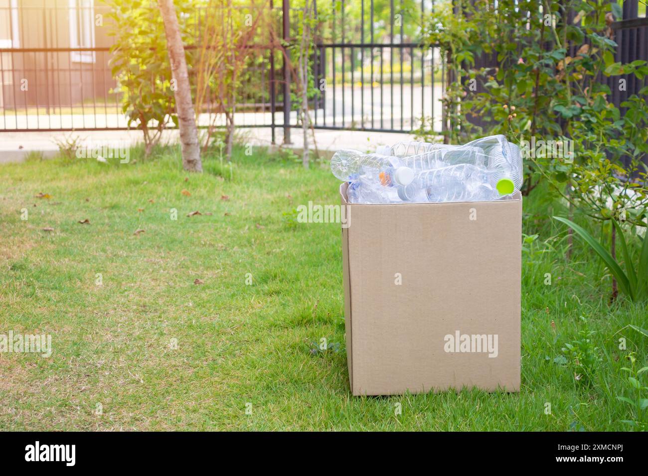 plastic bottles in brown recycle garbage box Stock Photo - Alamy