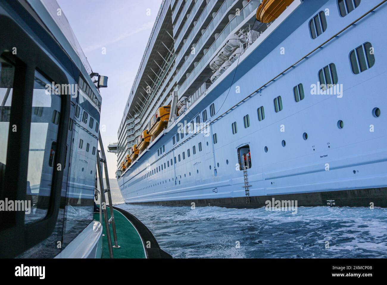 Nice, France : Harbor pilot boat approaching the giant Royal Caribbean ...