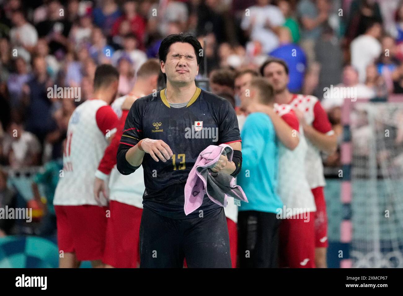 Shuichi Yoshida, of Japan, gestures after defeat against Croatia during ...