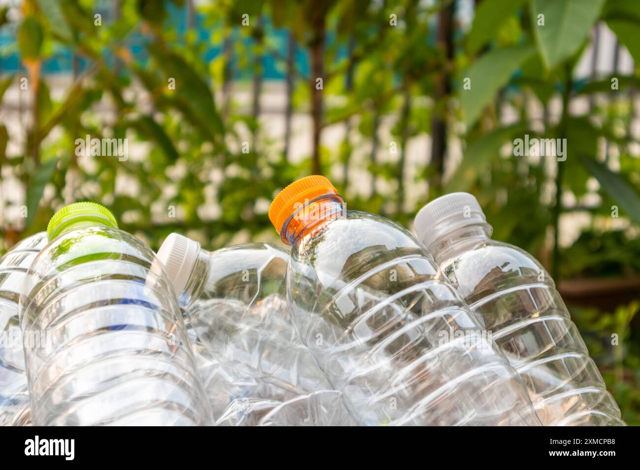 plastic bottles in brown recycle garbage box Stock Photo - Alamy