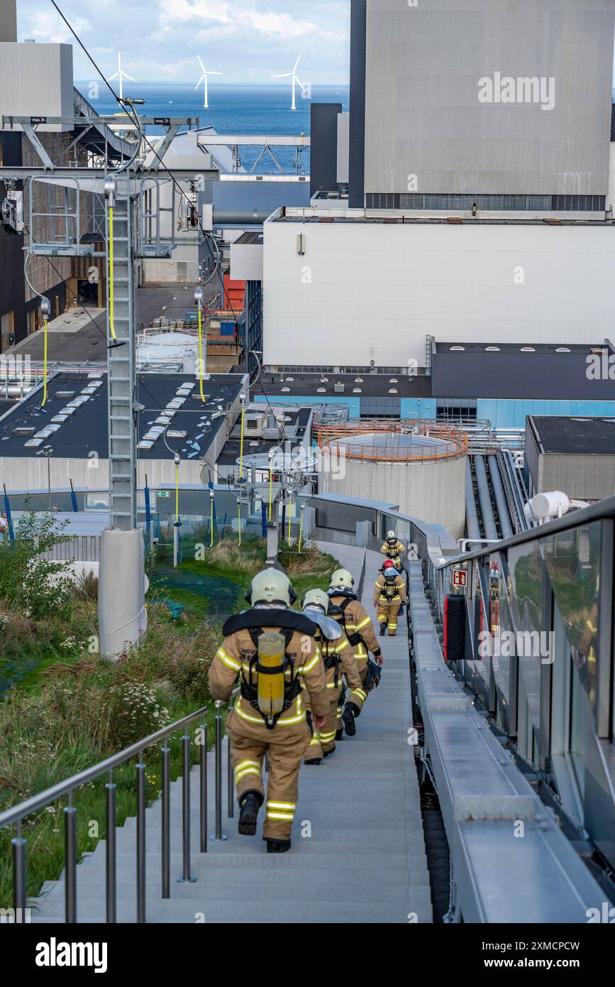 CopenHill, waste incineration plant and artificial ski slope, firefighters under respiratory ...